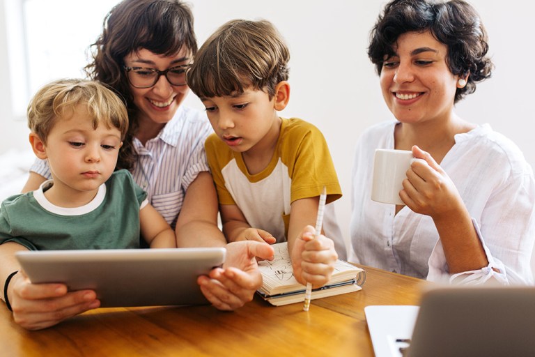 Young family at home with digital tablet | CT Mirror